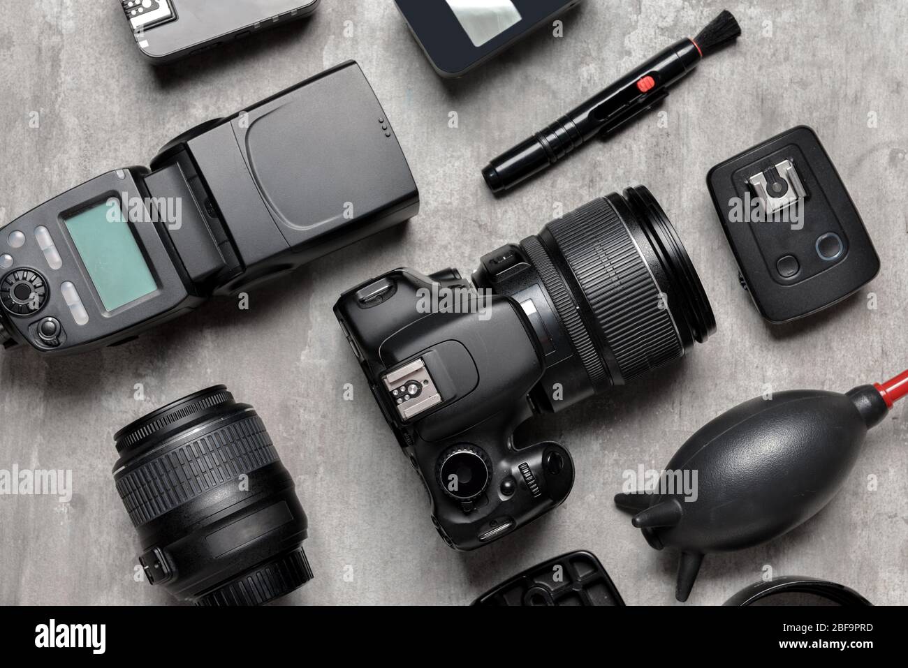 Modern photographer's equipment on grey background Stock Photo - Alamy