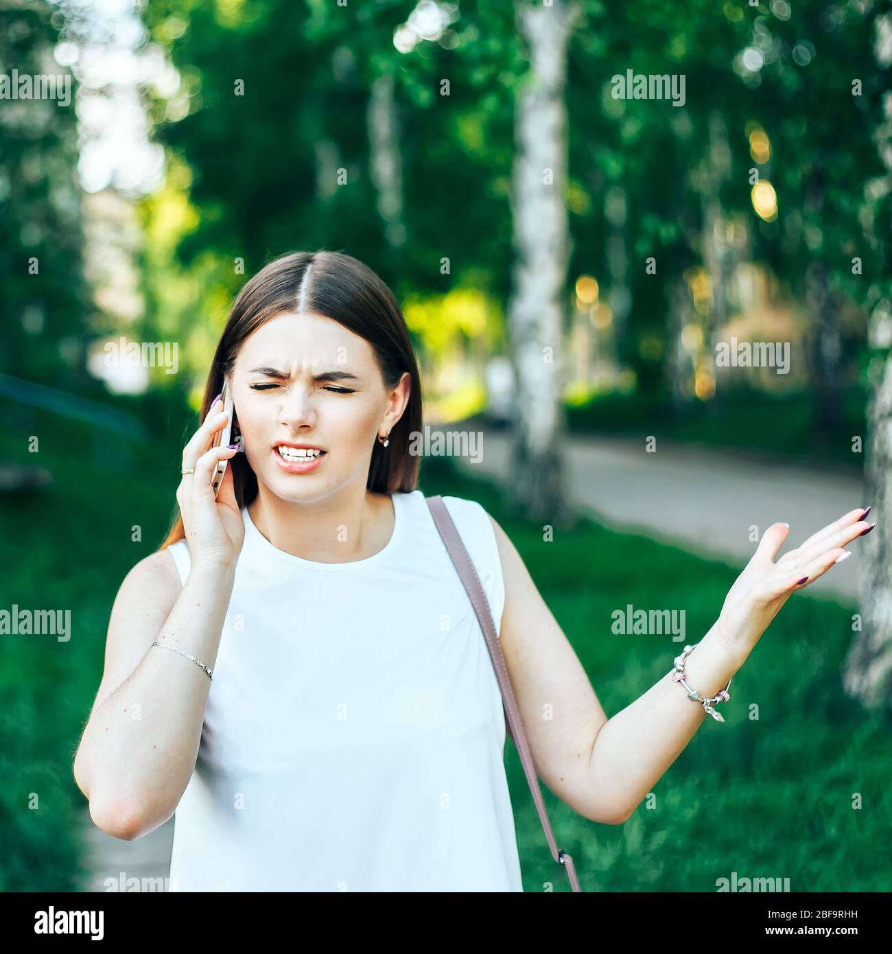 Beautiful asian girl walking talking hi-res stock photography and ...