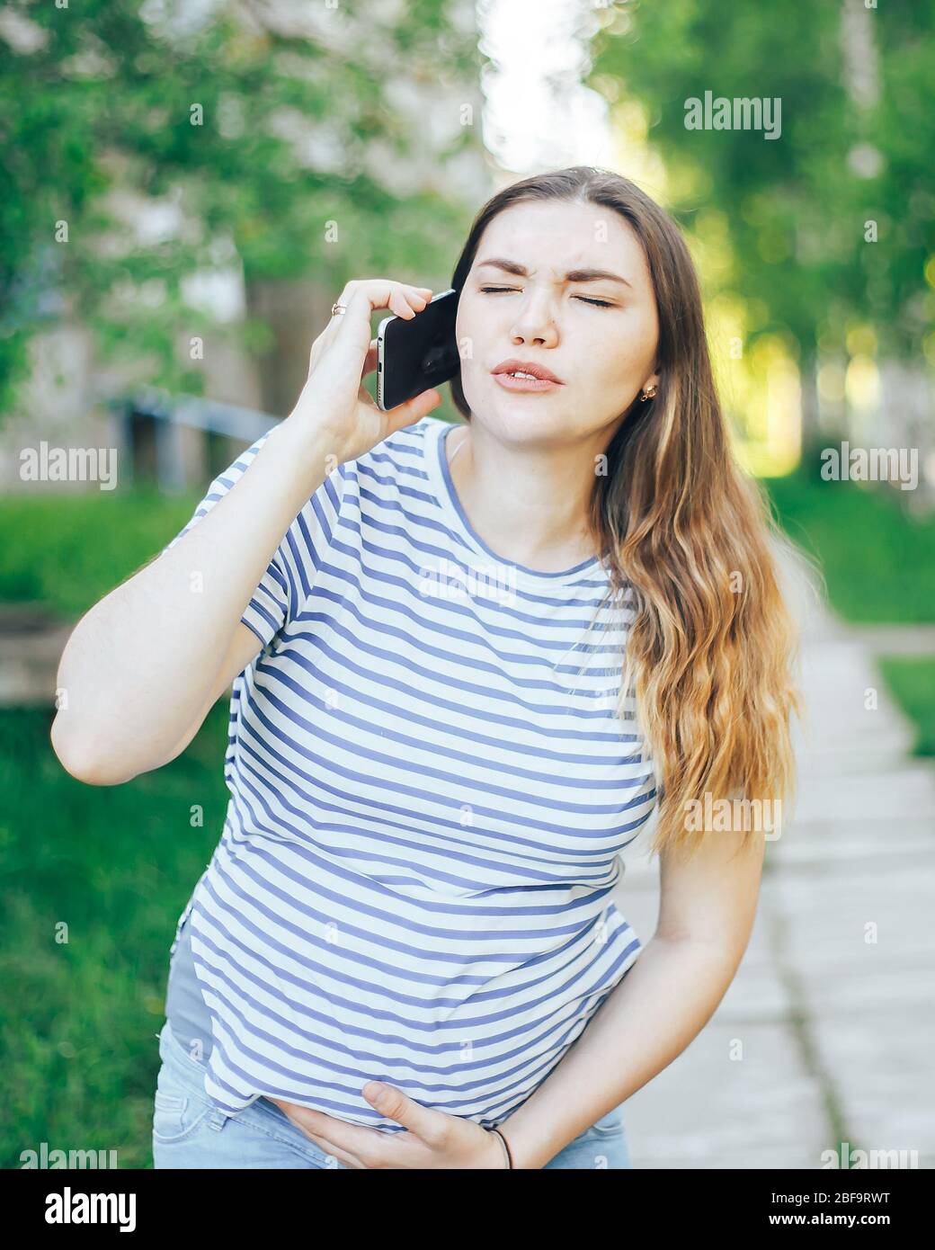 Pregnant woman with contractions feeling pain calling ambulance with ...