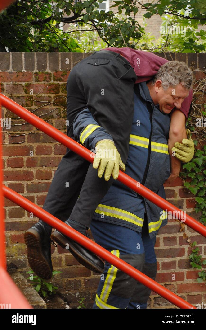Fireman rescue carry hi-res stock photography and images - Alamy