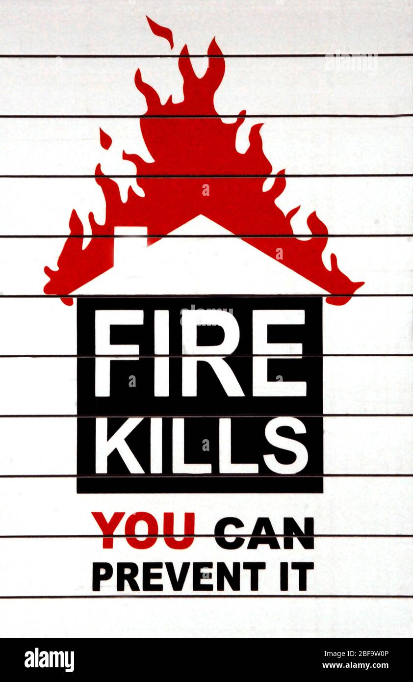A sign on the side of a fire engine warning of the dangers of fire ...