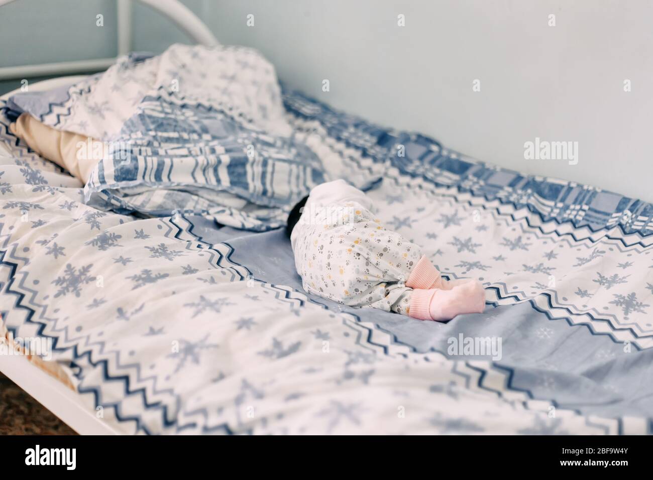 A newborn infant in maternity hospital. Happy parenthood. Healthy kid ...