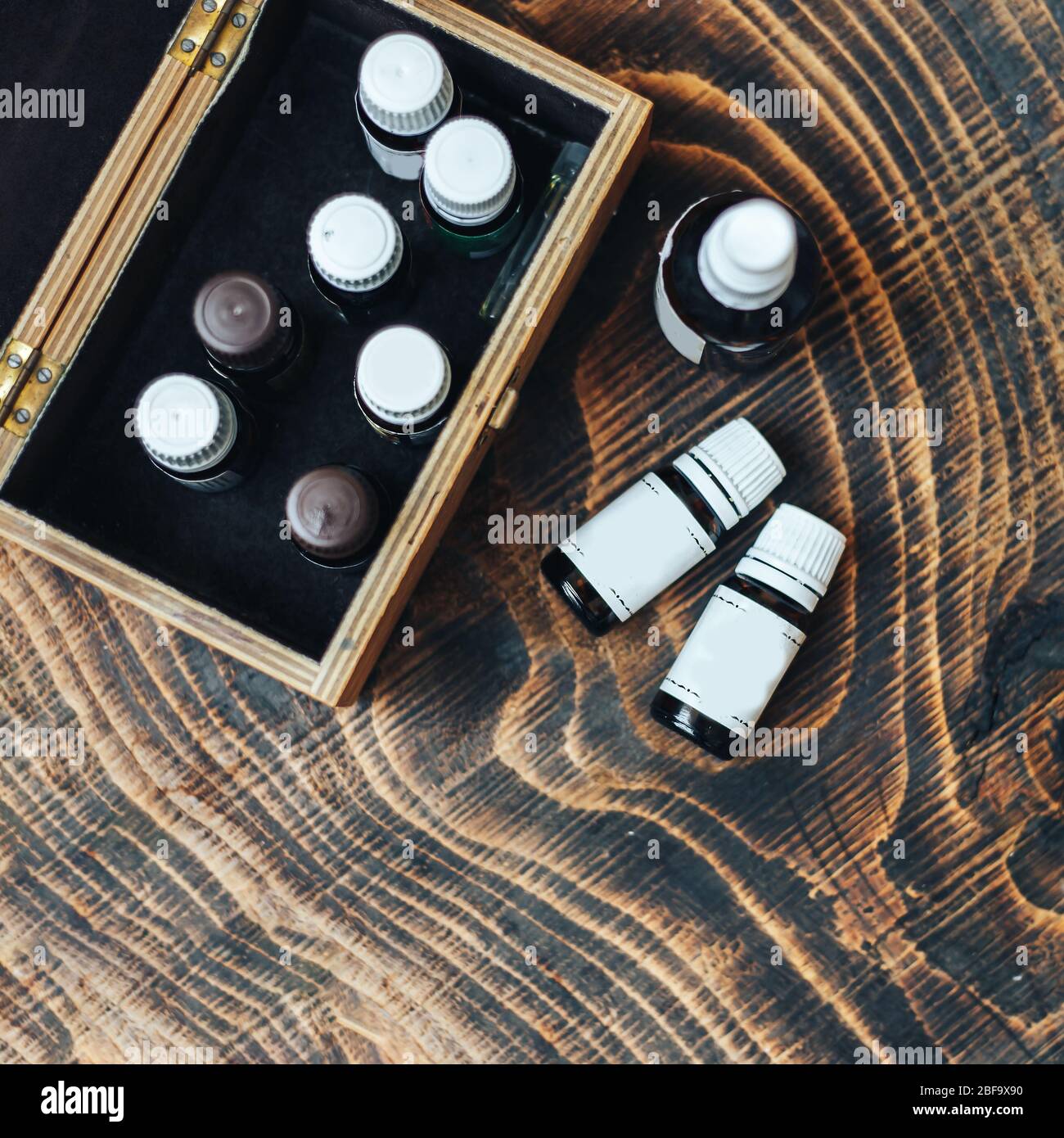 Glass bottles with different scents and exotic types of essential oils ...