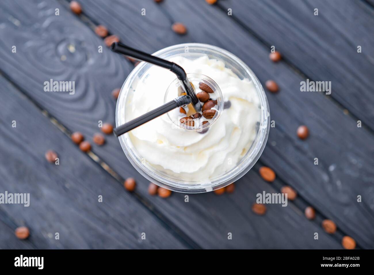 Cup of tasty iced coffee on table Stock Photo - Alamy