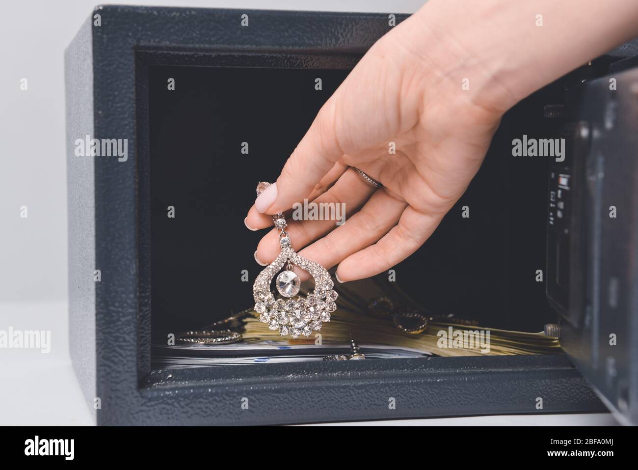 Taking valuables hi-res stock photography and images - Alamy
