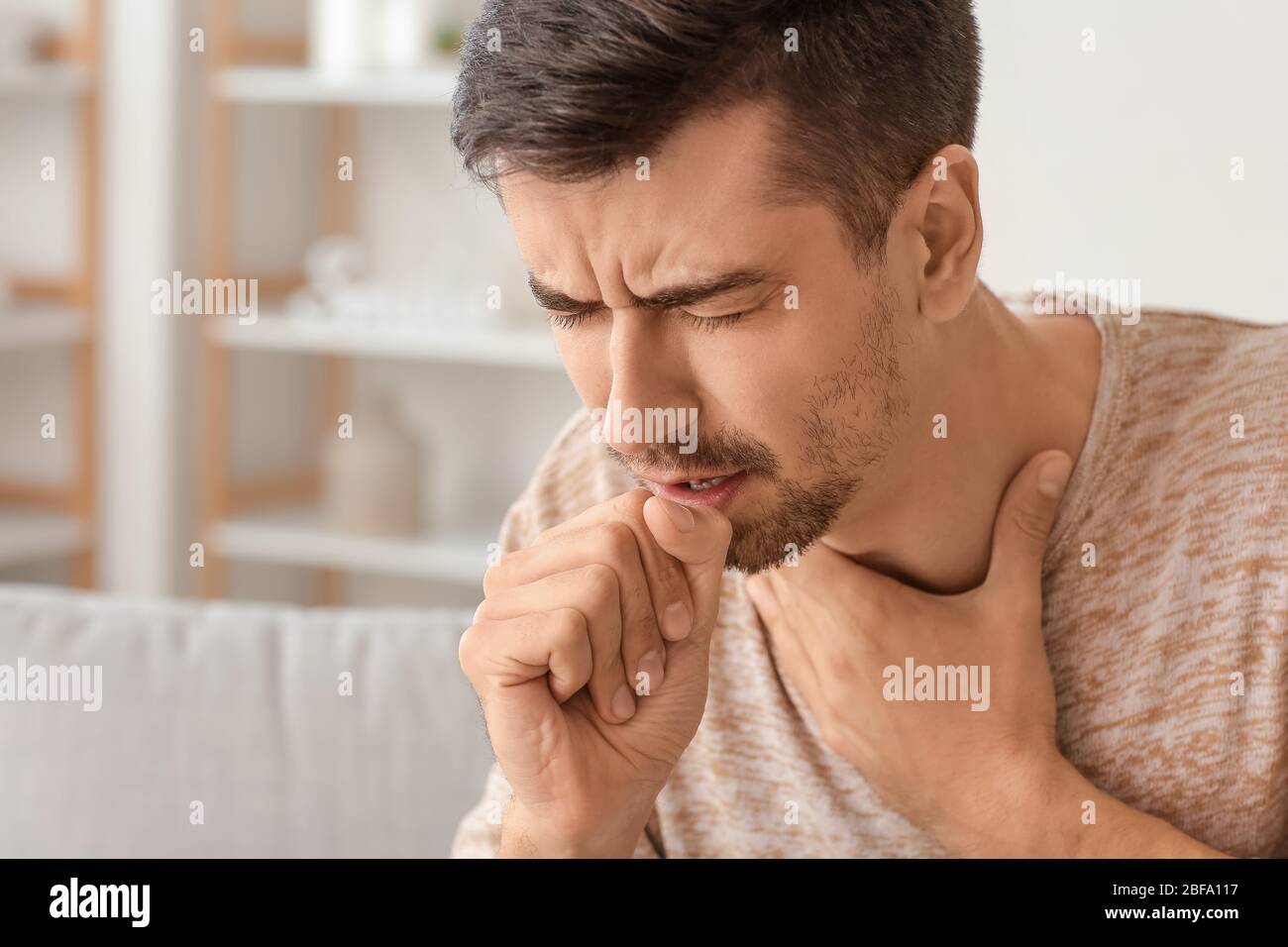 Sick man coughing sitting home hi-res stock photography and images - Alamy