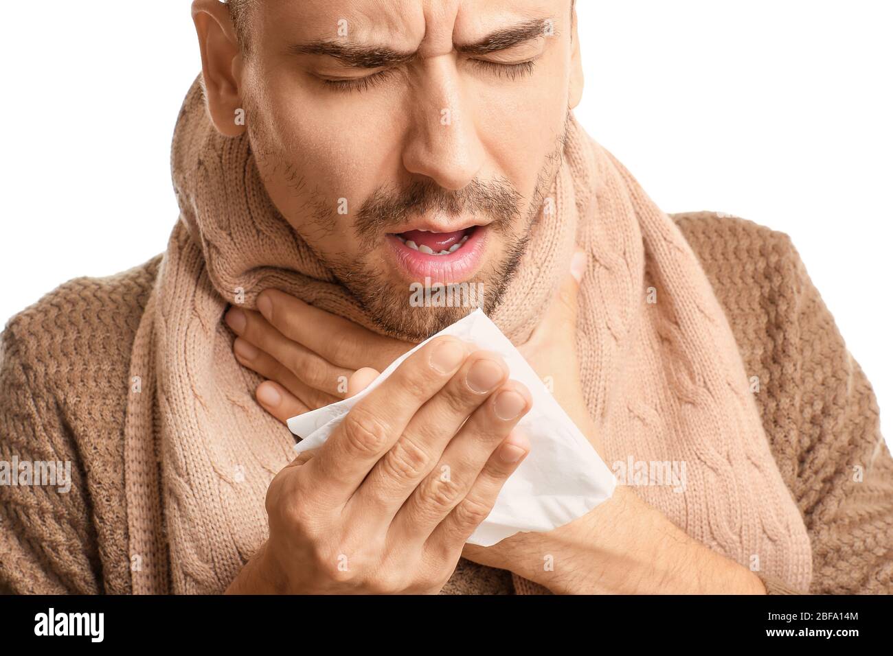 Coughing young man on white background Stock Photo - Alamy