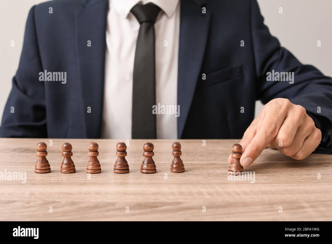 Man removing chess piece from table. Concept of dismissal Stock Photo ...