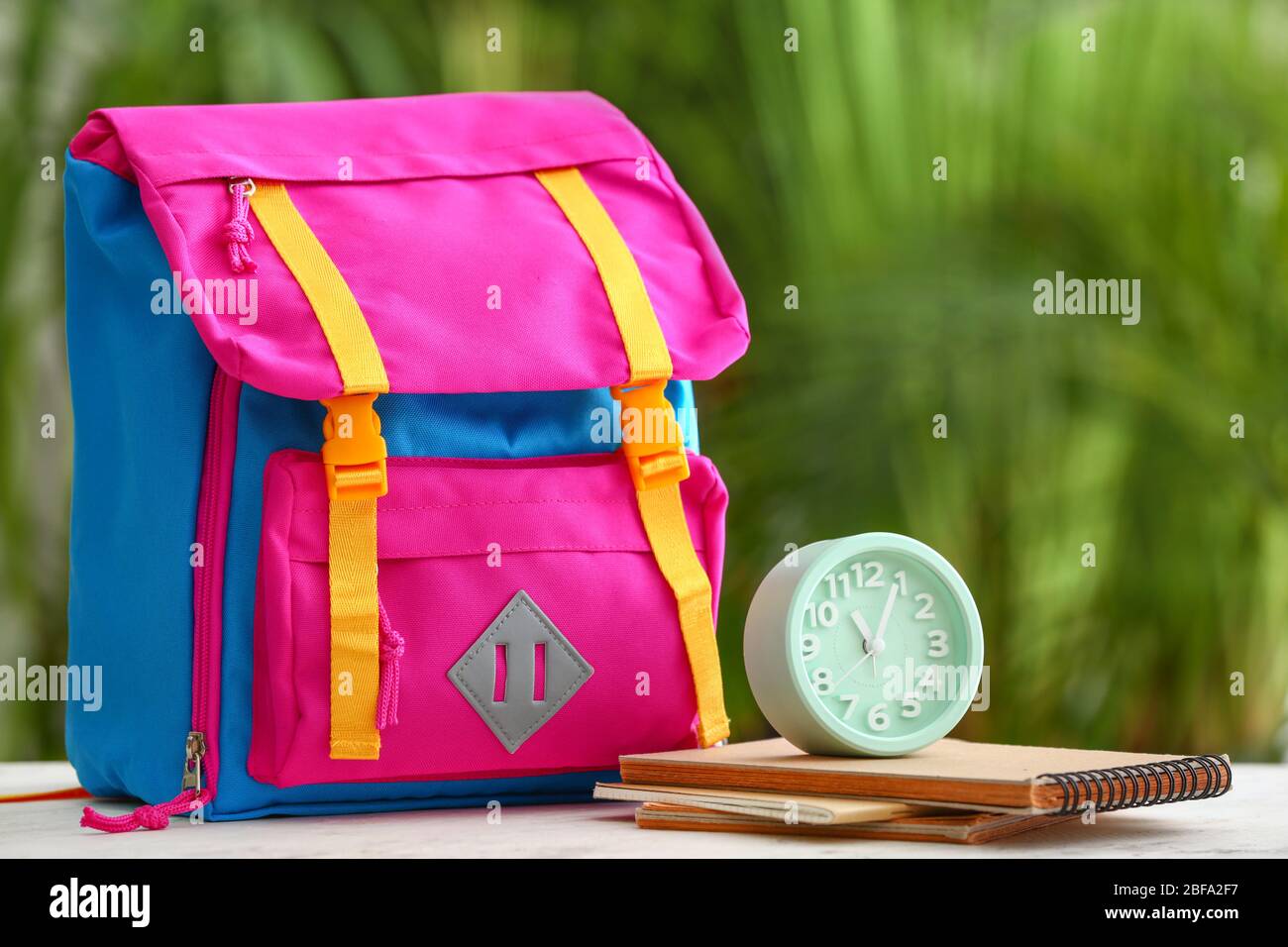School backpack on table outdoors Stock Photo - Alamy