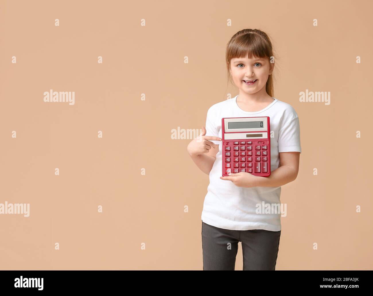 Little girl with calculator on color background Stock Photo - Alamy