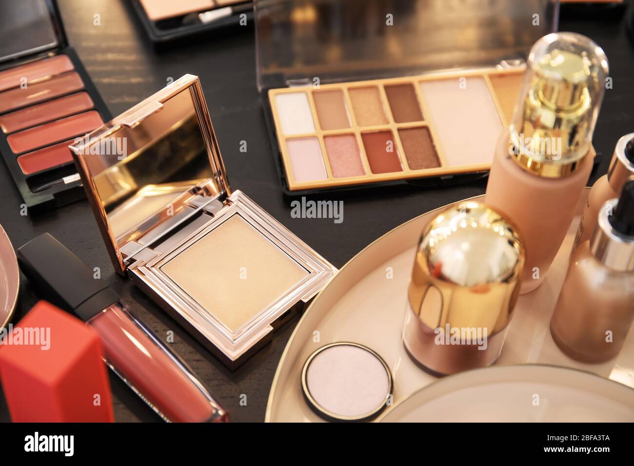 Different cosmetics on table of makeup artist Stock Photo - Alamy