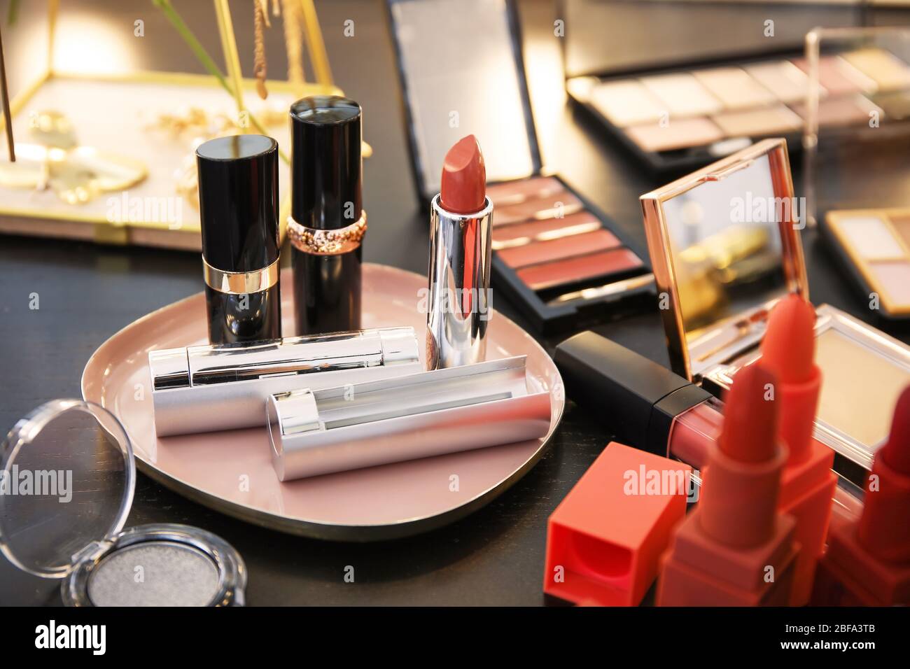 Different cosmetics on table of makeup artist Stock Photo - Alamy