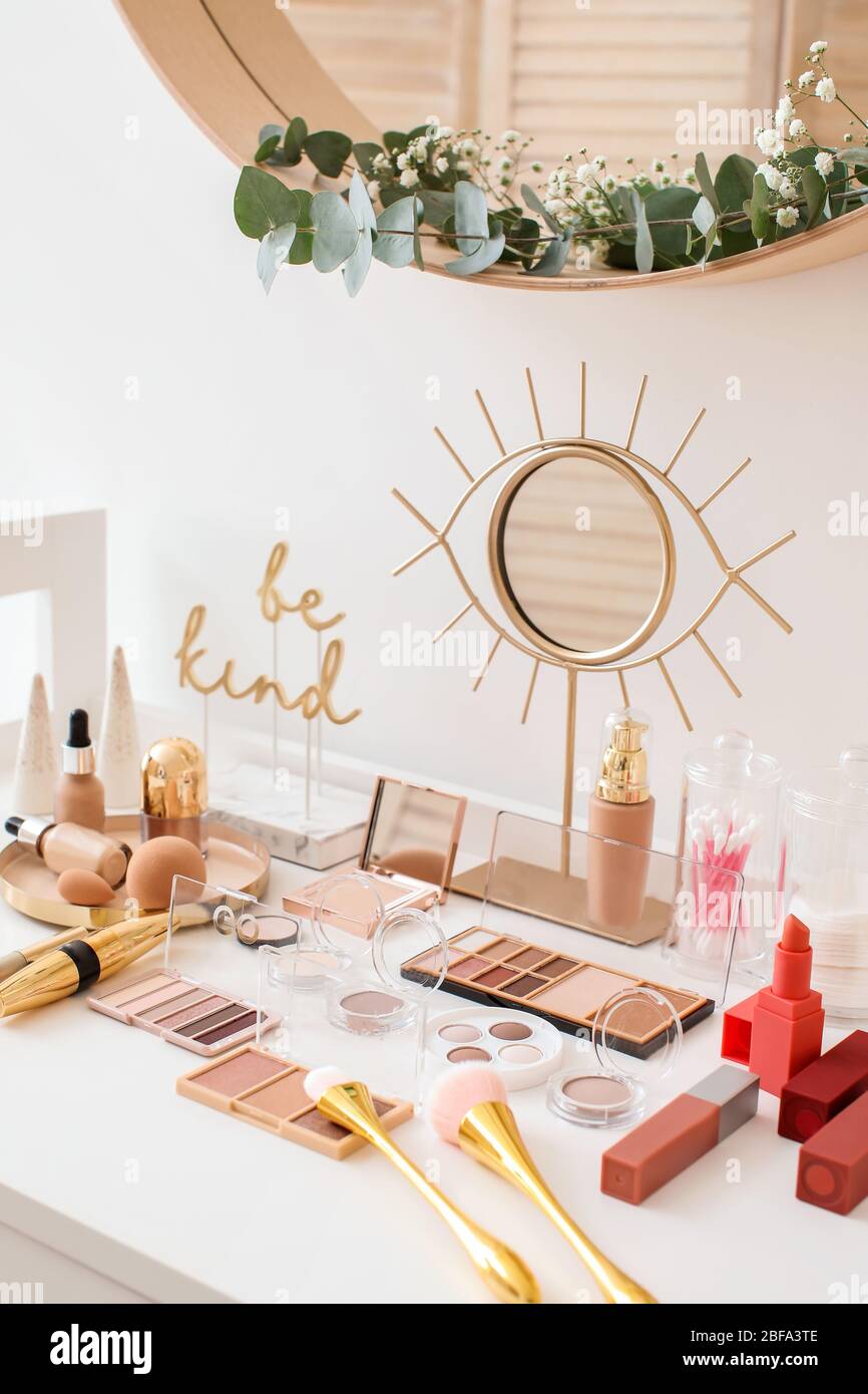 Different cosmetics on table of makeup artist Stock Photo - Alamy