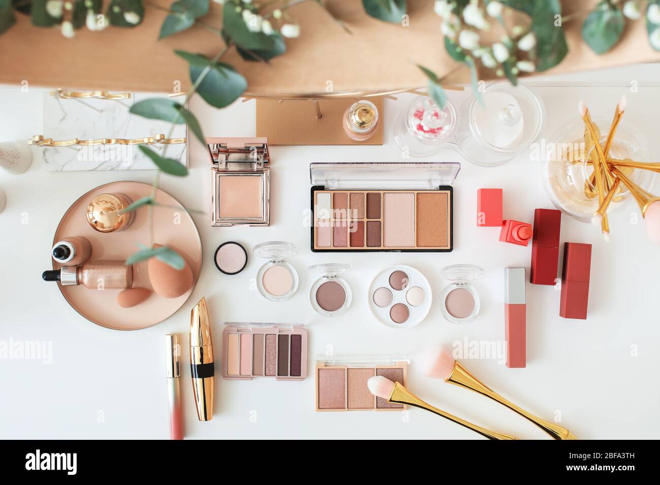 Different cosmetics on table of makeup artist Stock Photo - Alamy