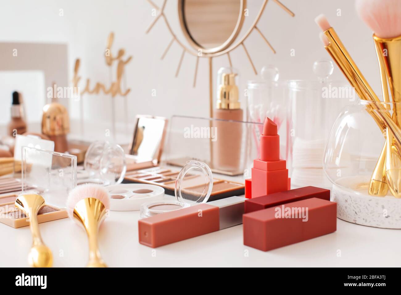 Different cosmetics on table of makeup artist Stock Photo - Alamy