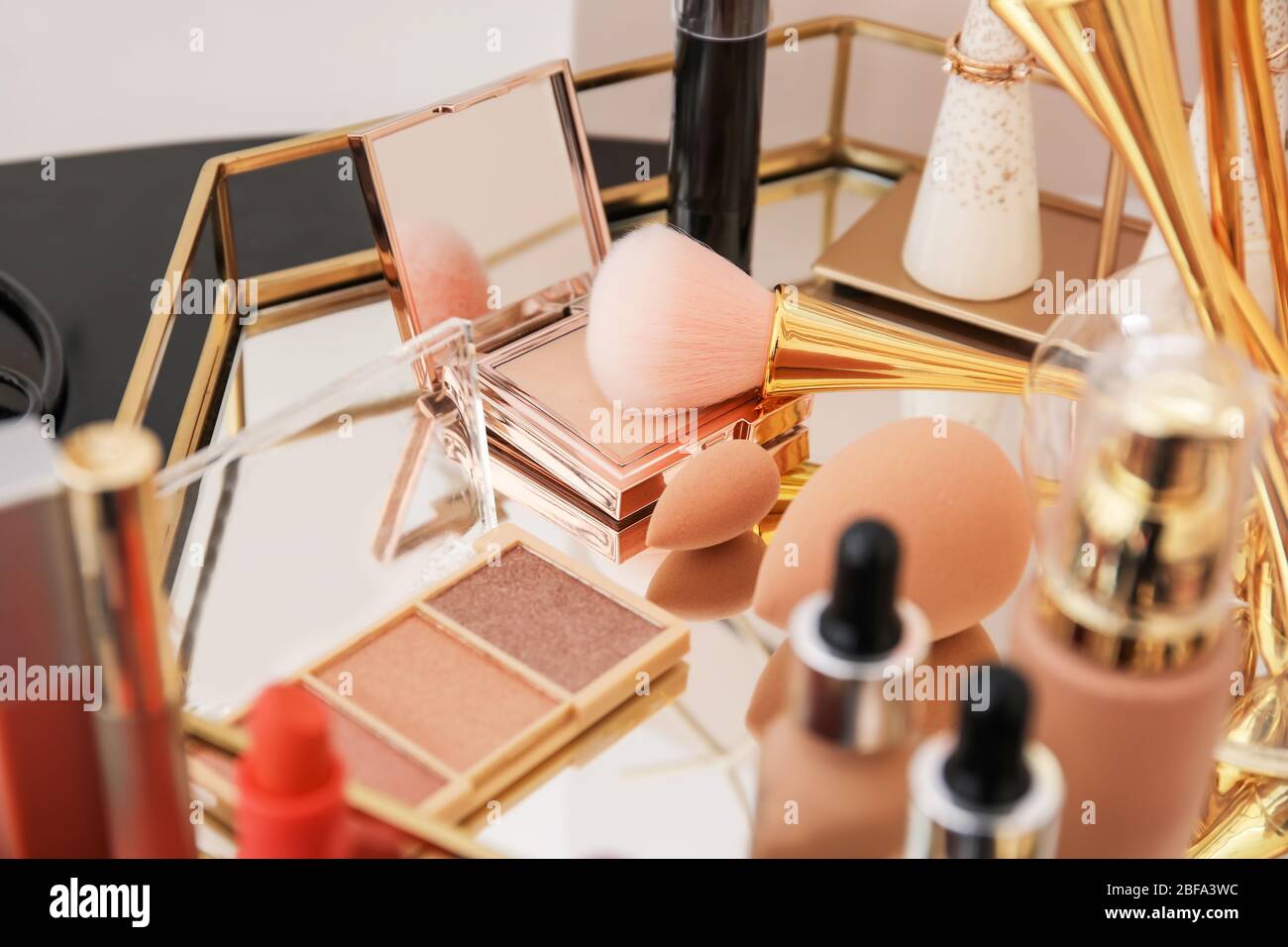 Different cosmetics on table of makeup artist Stock Photo - Alamy