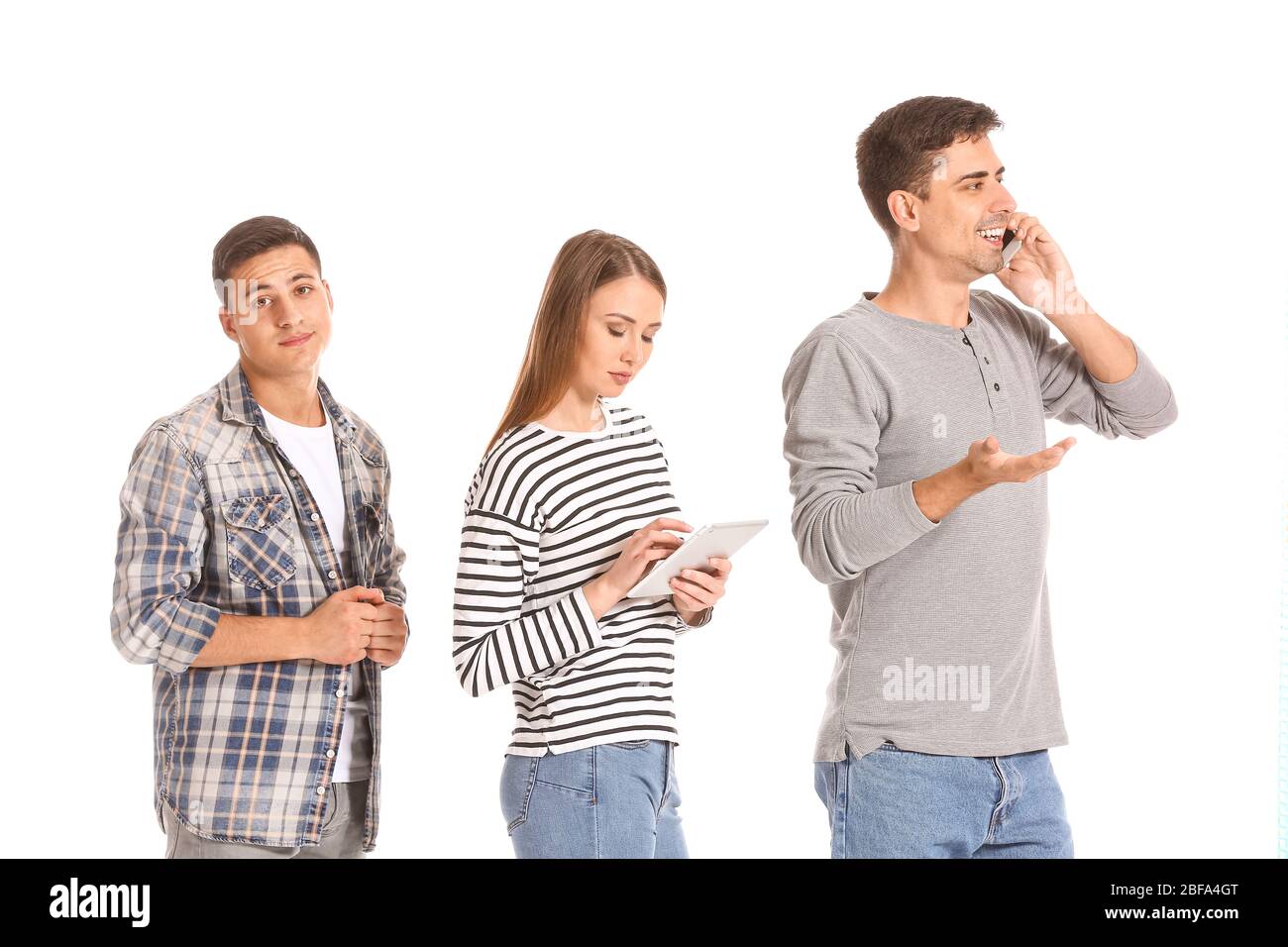 Young people waiting in line on white background Stock Photo - Alamy