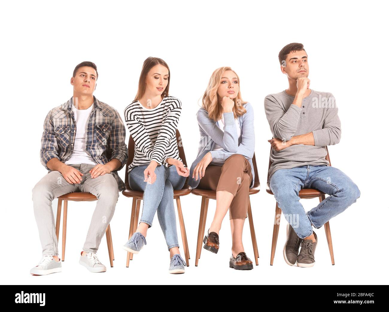 Young people waiting in line on white background Stock Photo - Alamy