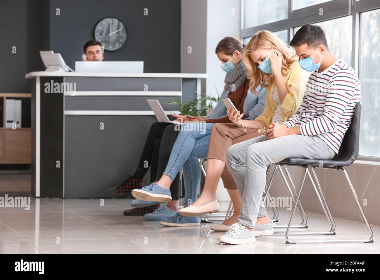 Patients waiting in hall of clinic Stock Photo - Alamy