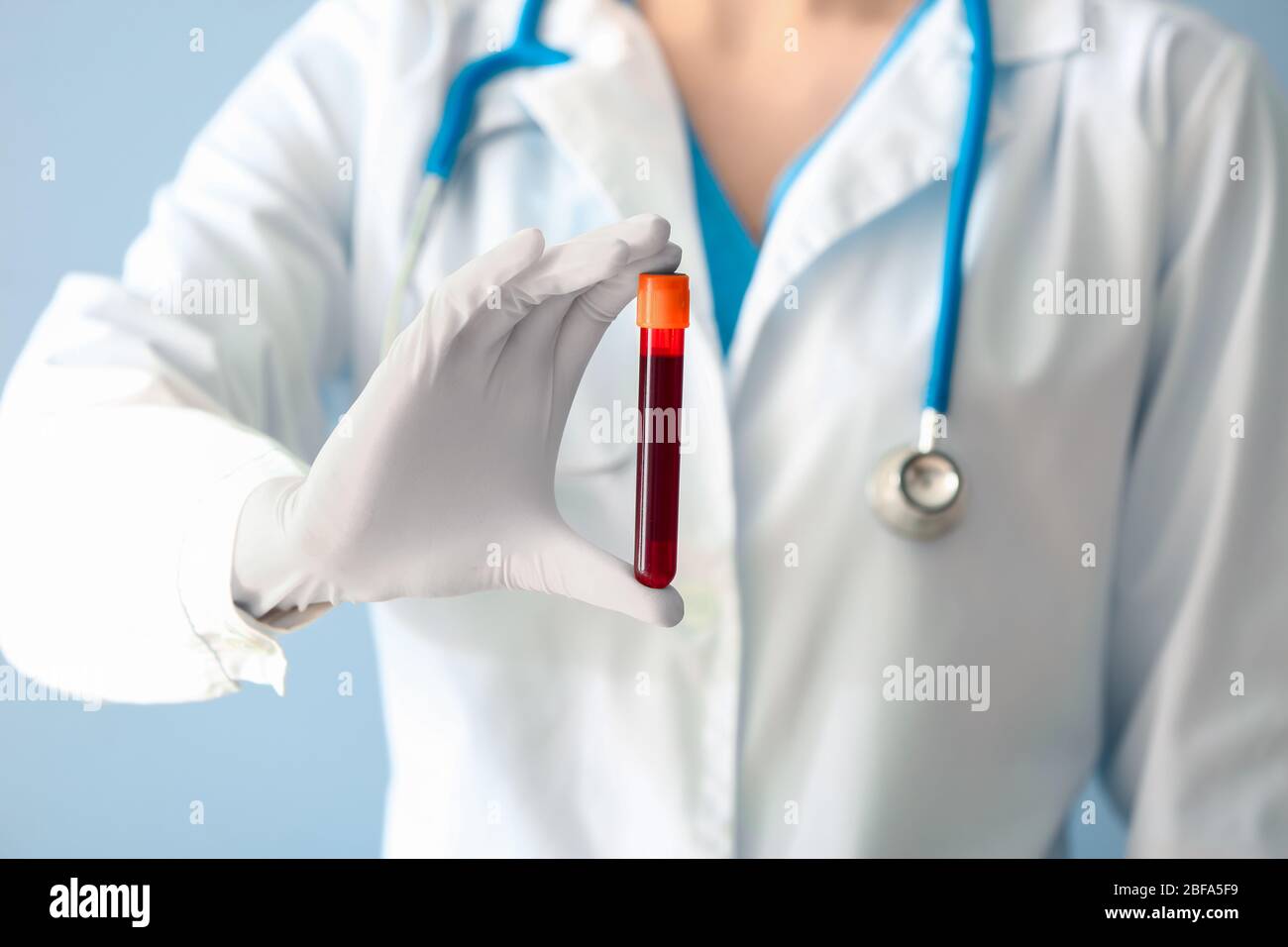 Doctor holding test tube with blood sample, closeup Stock Photo - Alamy
