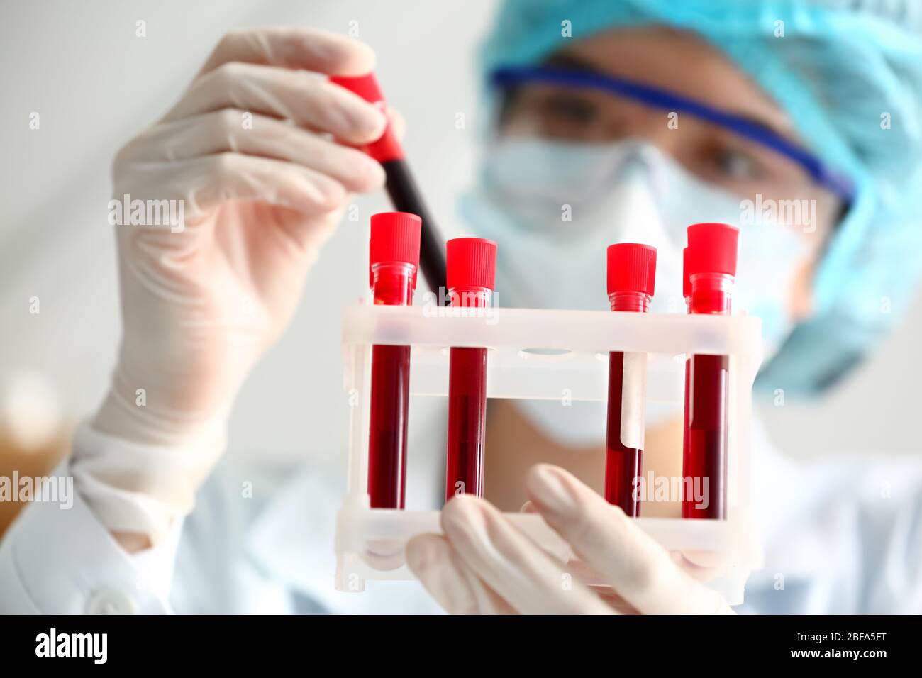 Doctor working with blood samples in laboratory Stock Photo - Alamy