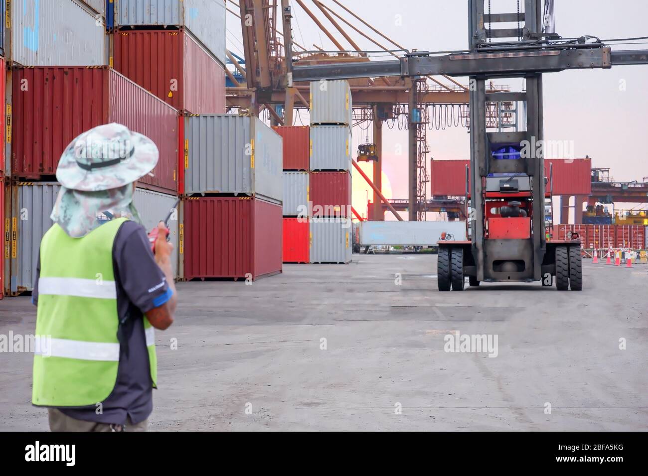 Supervisor Loading container trucks for the background Export Import ...