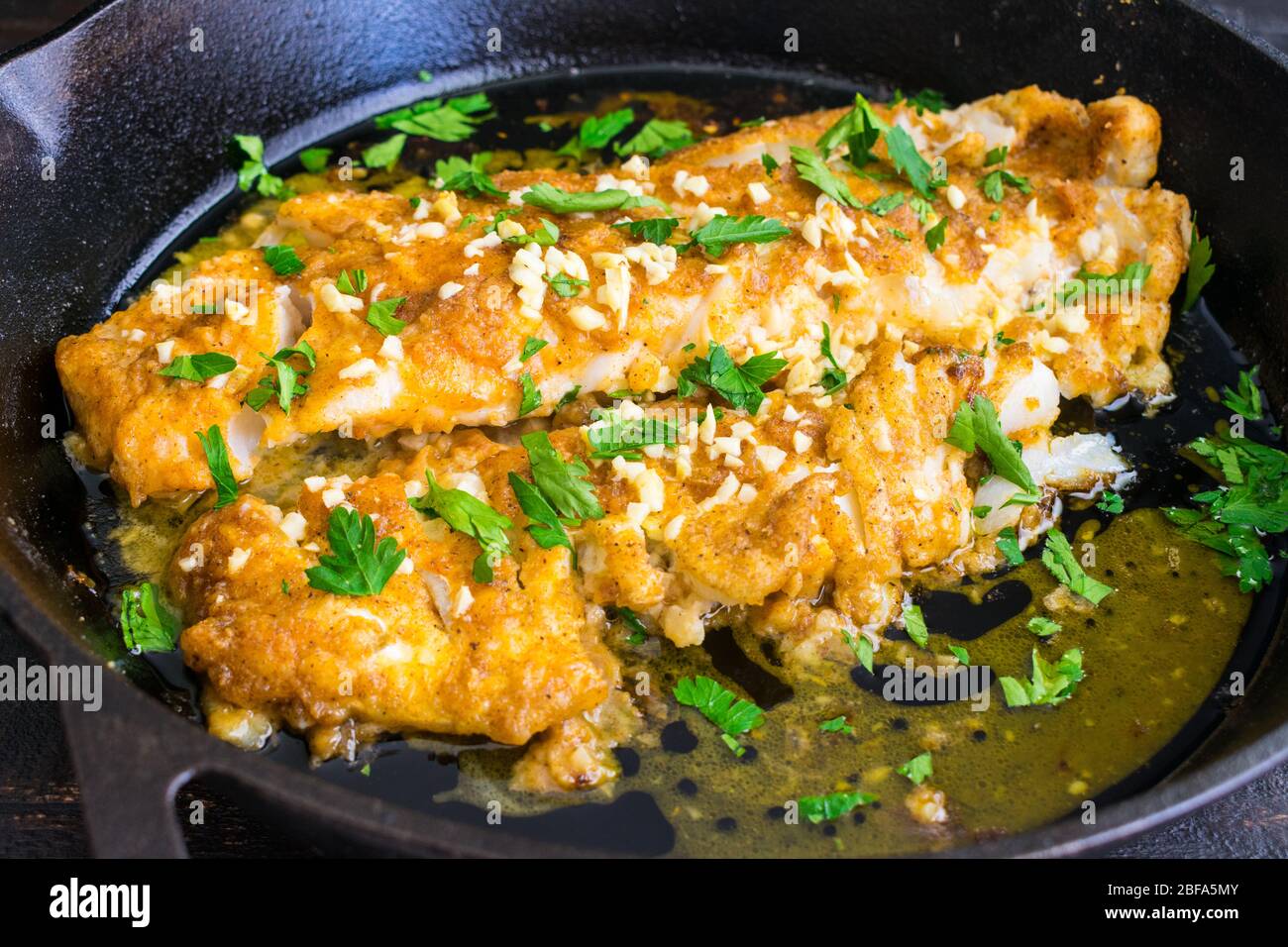 Baked Cod with Lemon and Garlic: Breaded whitefish fillet topped with ...