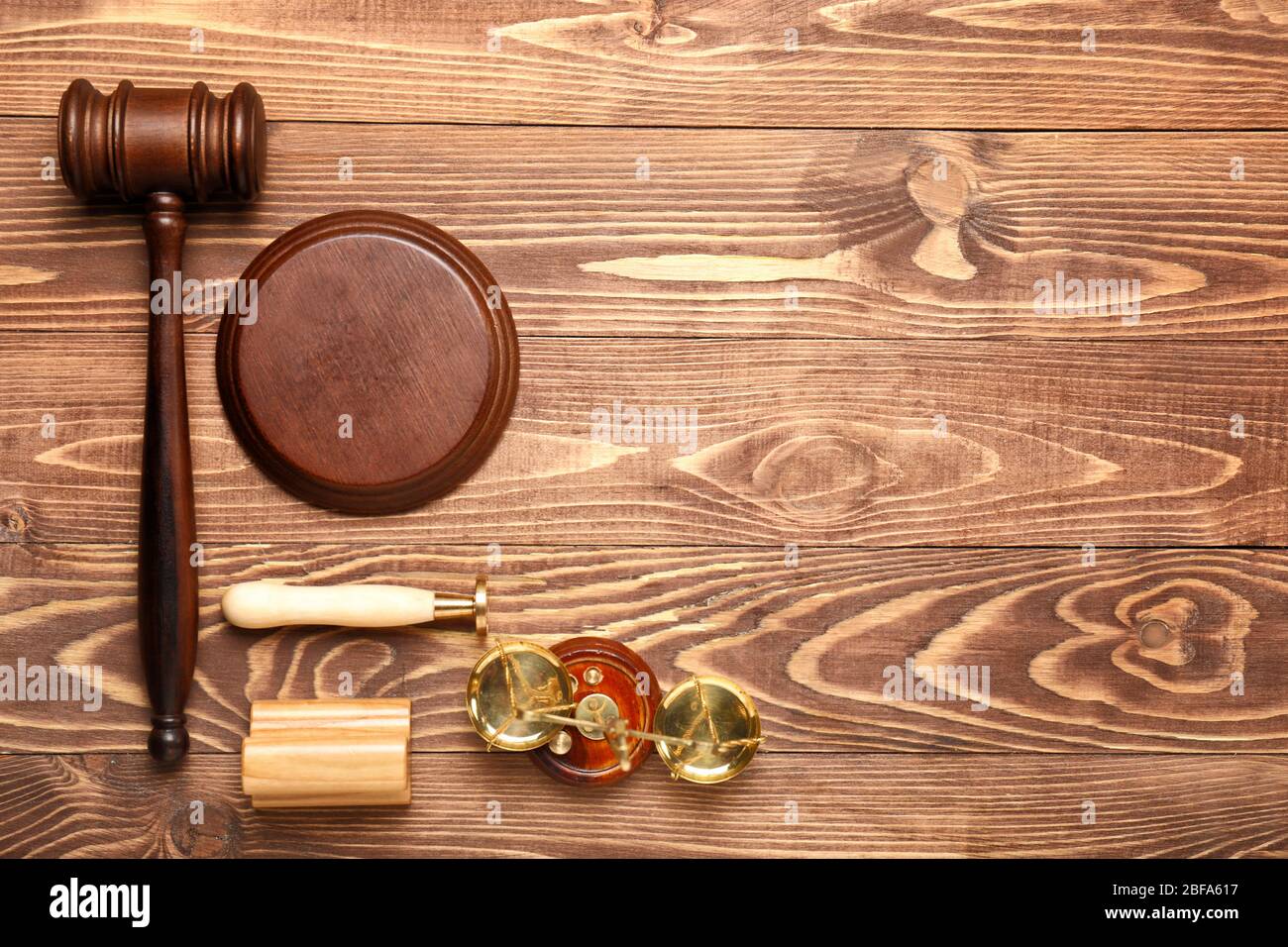 Judge's gavel, stamps and scales of justice on wooden background Stock ...
