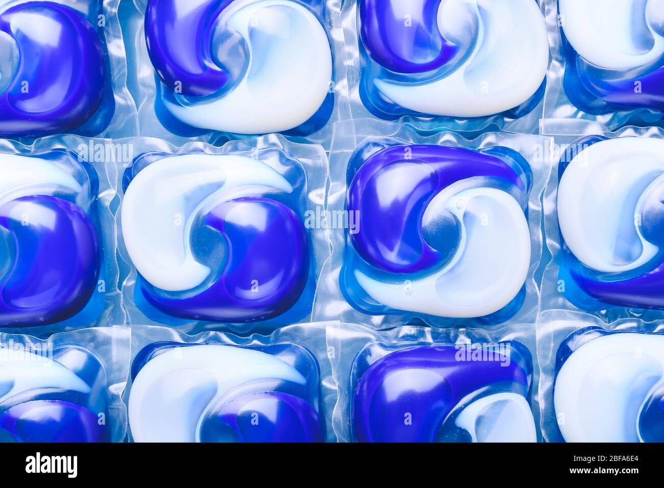 Many capsules with laundry detergent as background Stock Photo - Alamy