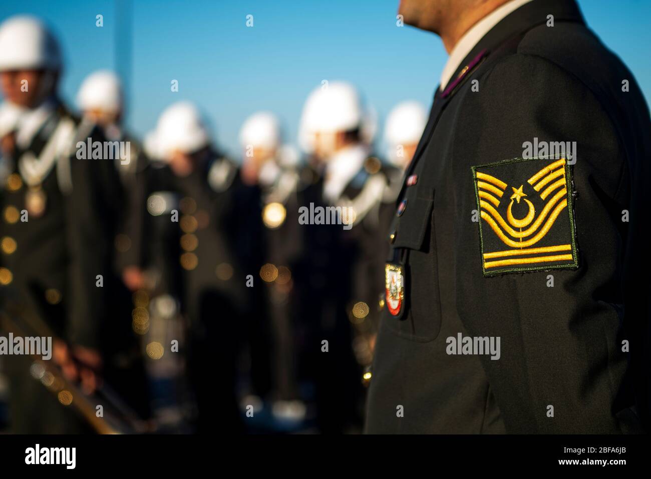 Emblem of a staff sergeant on the shoulder on the uniform on the ...