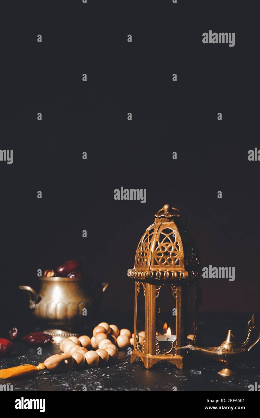 Muslim lamps with tasbih on dark background Stock Photo - Alamy