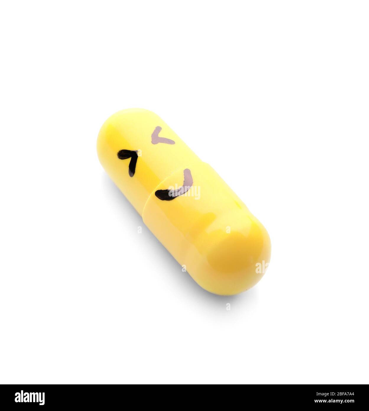 Pill with drawn face on white background Stock Photo - Alamy