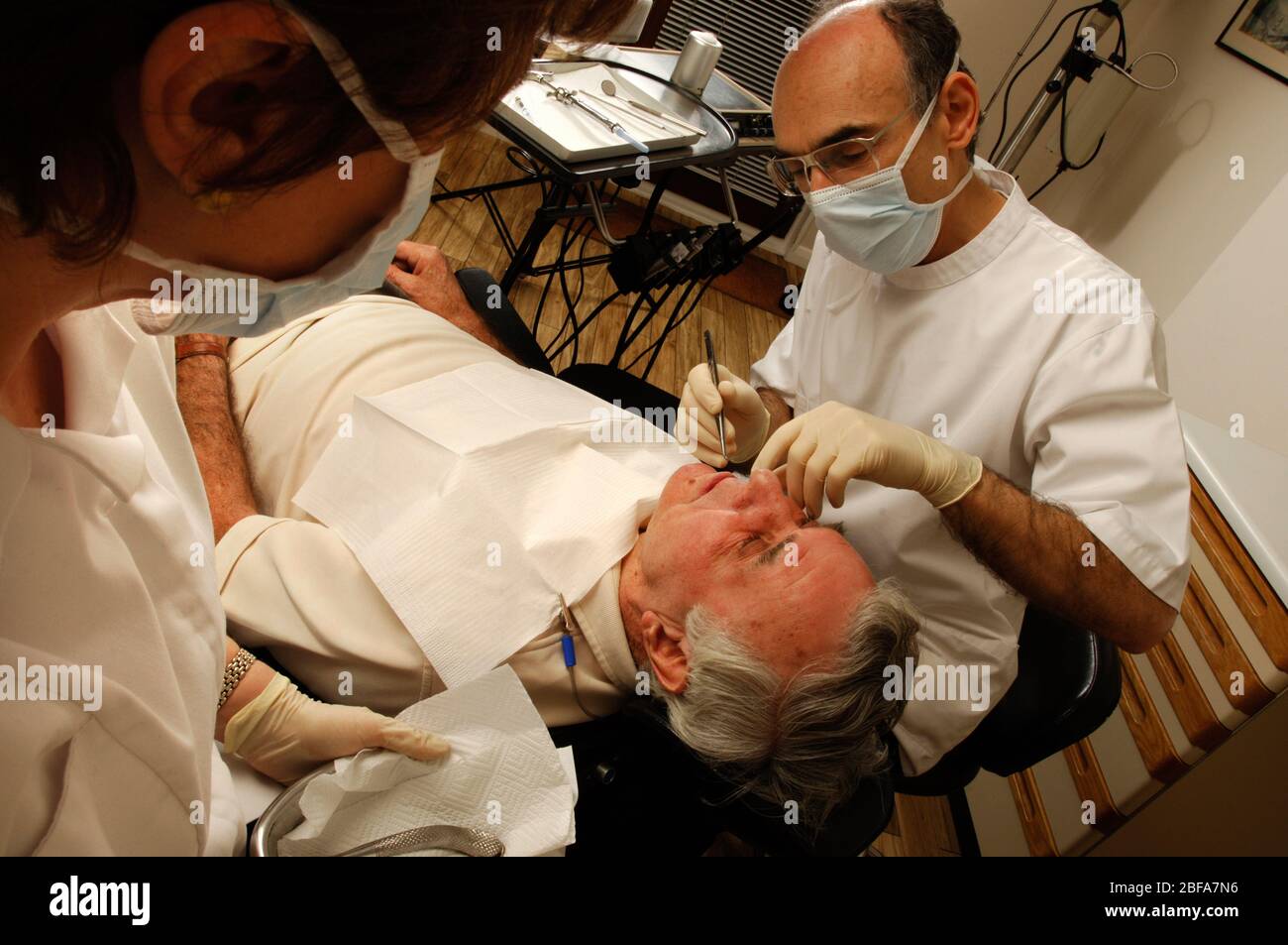Hands male dentist examining teeth hi-res stock photography and images ...