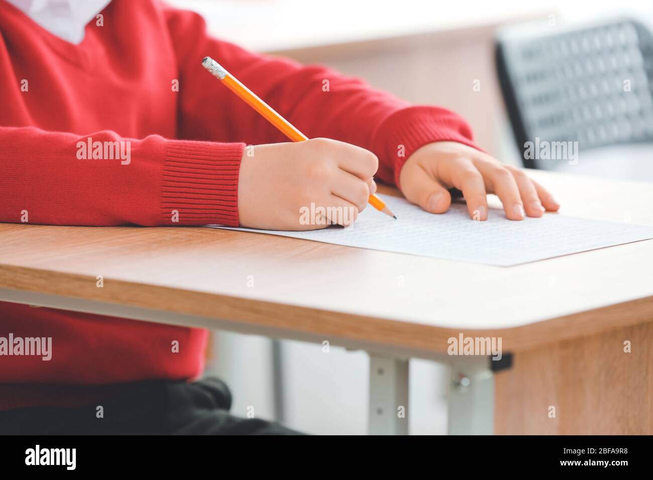 Pupil passing exam at school Stock Photo - Alamy
