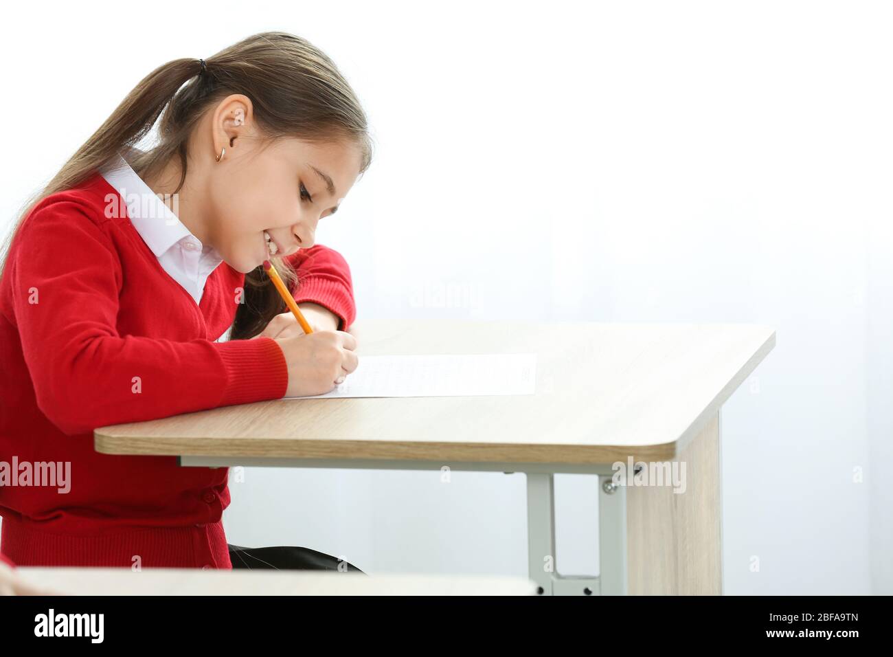 Pupil passing exam at school Stock Photo - Alamy