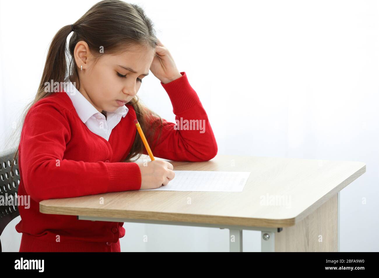 Pupil passing exam at school Stock Photo - Alamy