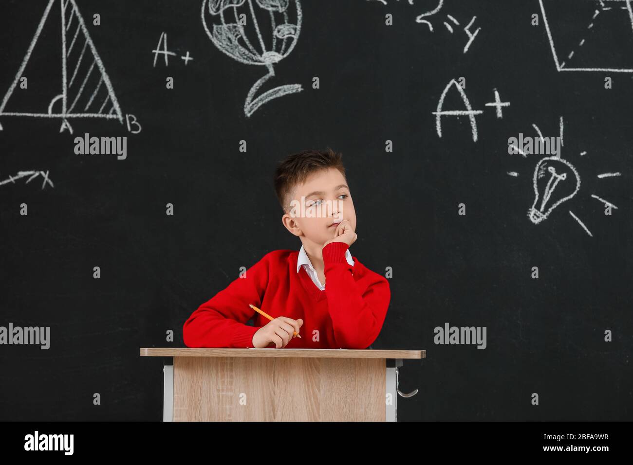 Pupil passing exam at school Stock Photo - Alamy