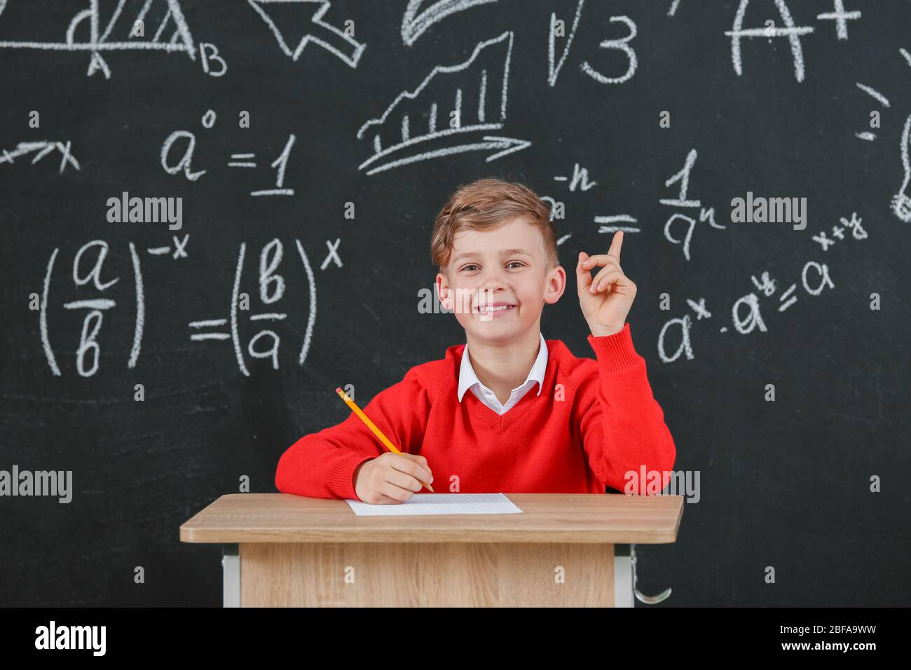 Pupil passing exam at school Stock Photo - Alamy