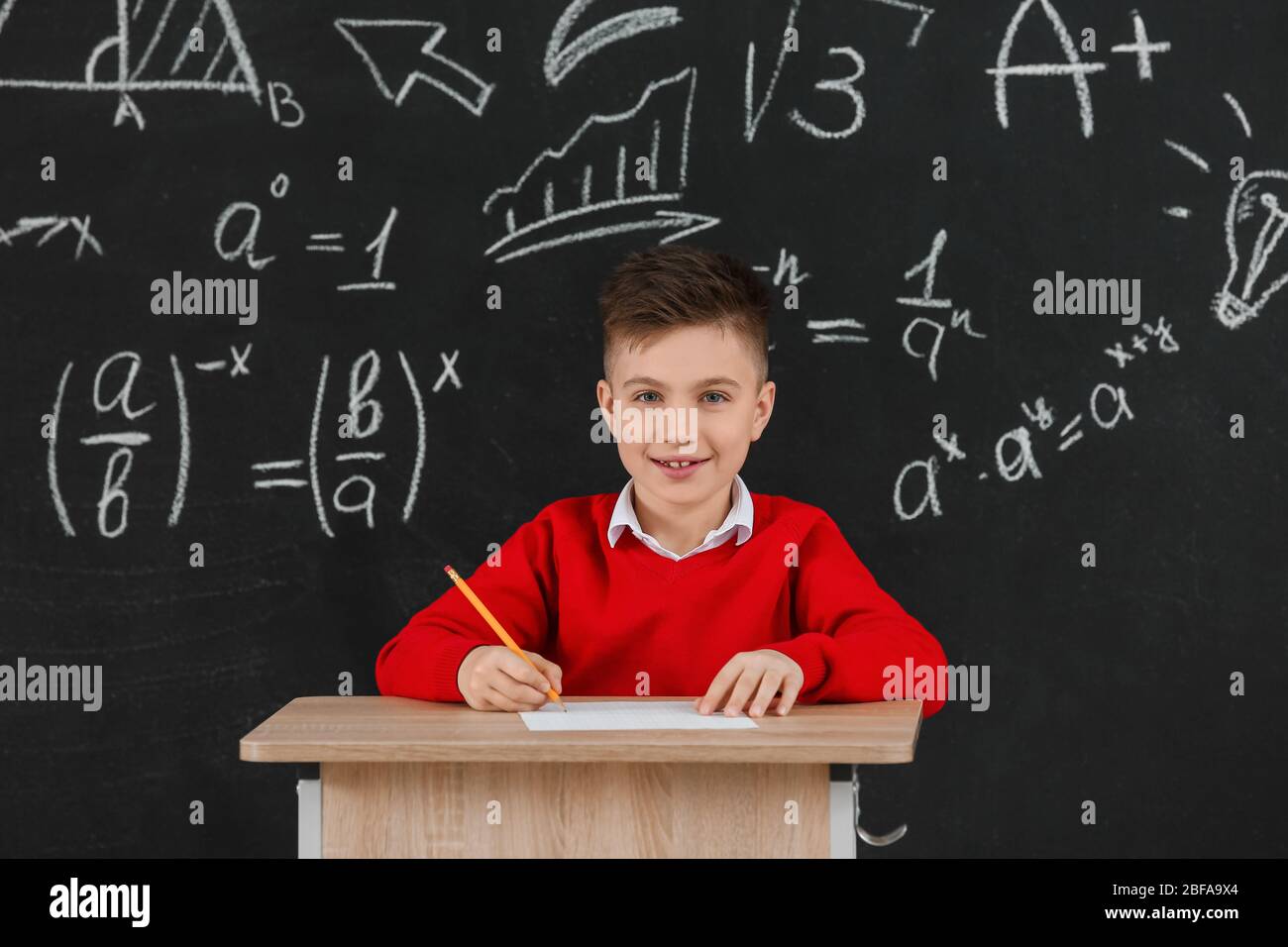 Pupil passing exam at school Stock Photo - Alamy