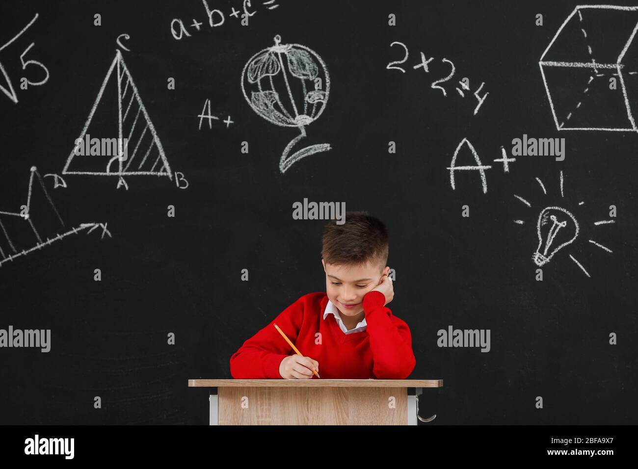 Pupil passing exam at school Stock Photo - Alamy