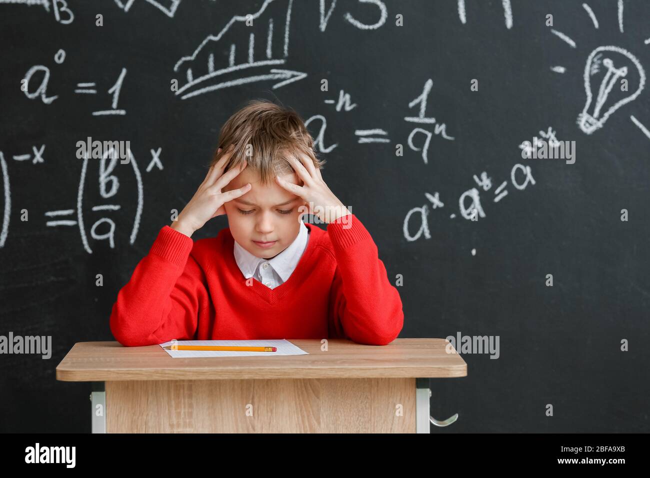 Pupil passing exam at school Stock Photo - Alamy