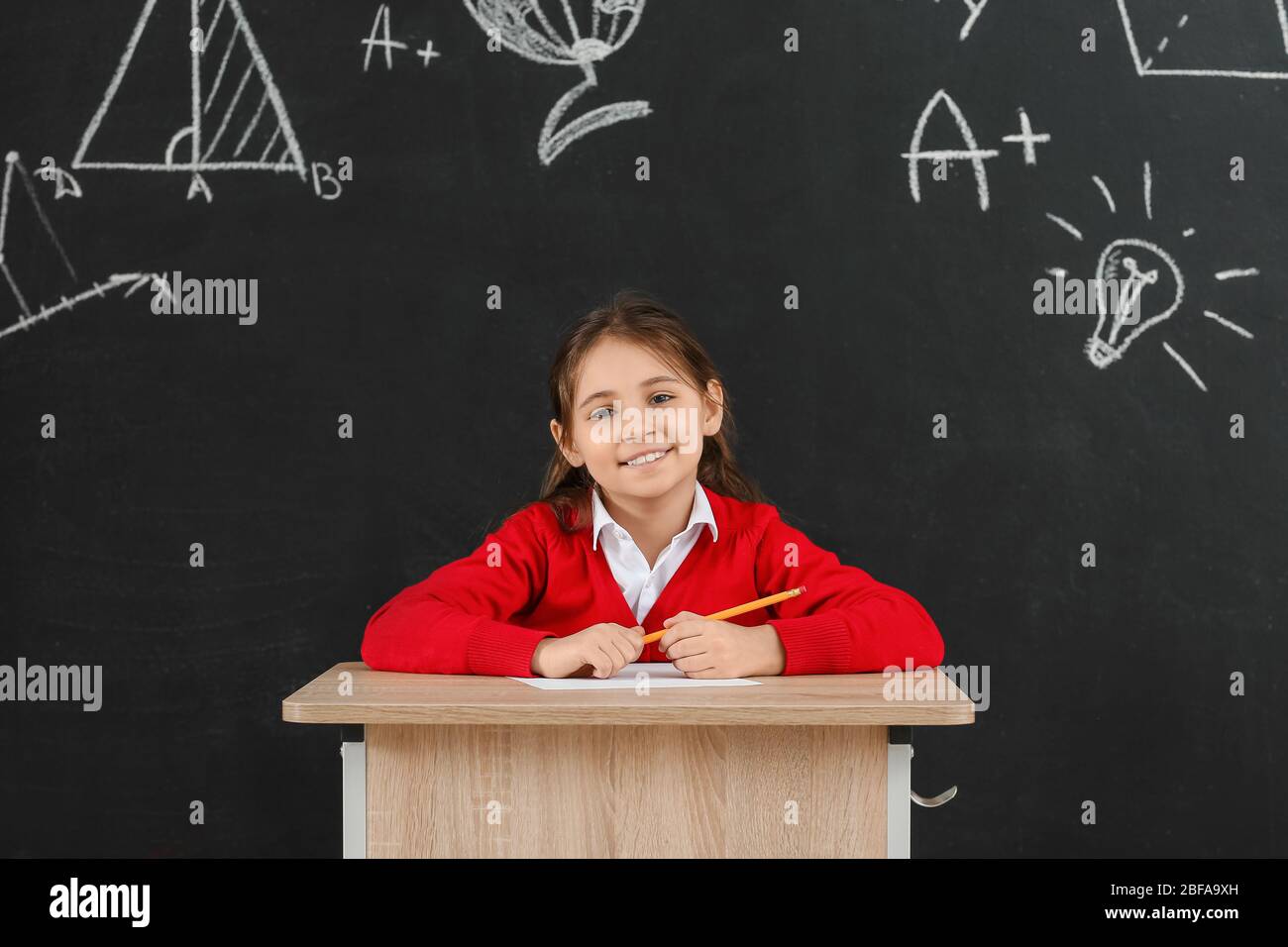 Pupil passing exam at school Stock Photo - Alamy