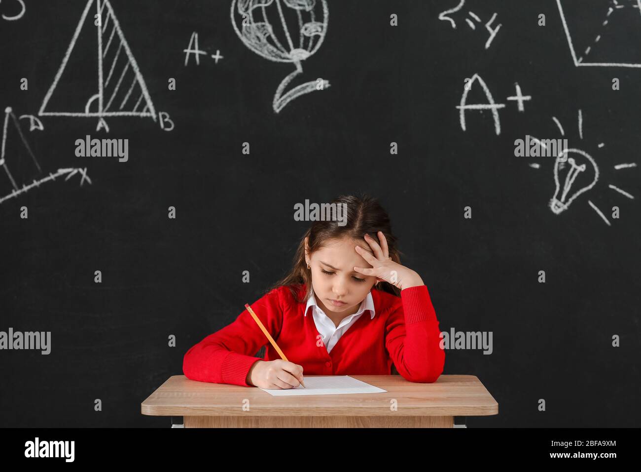Pupil passing exam at school Stock Photo - Alamy