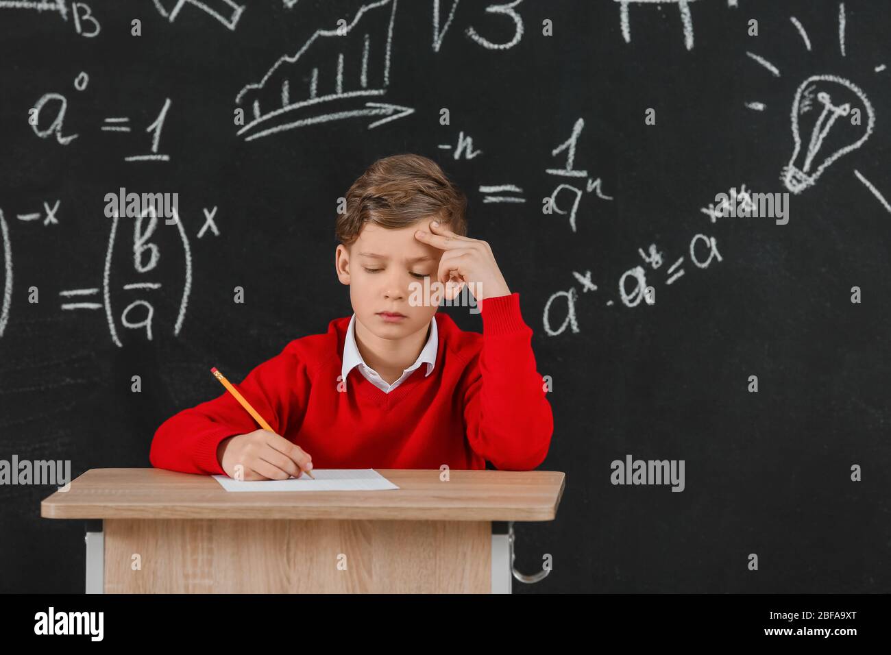 Pupil passing exam at school Stock Photo - Alamy