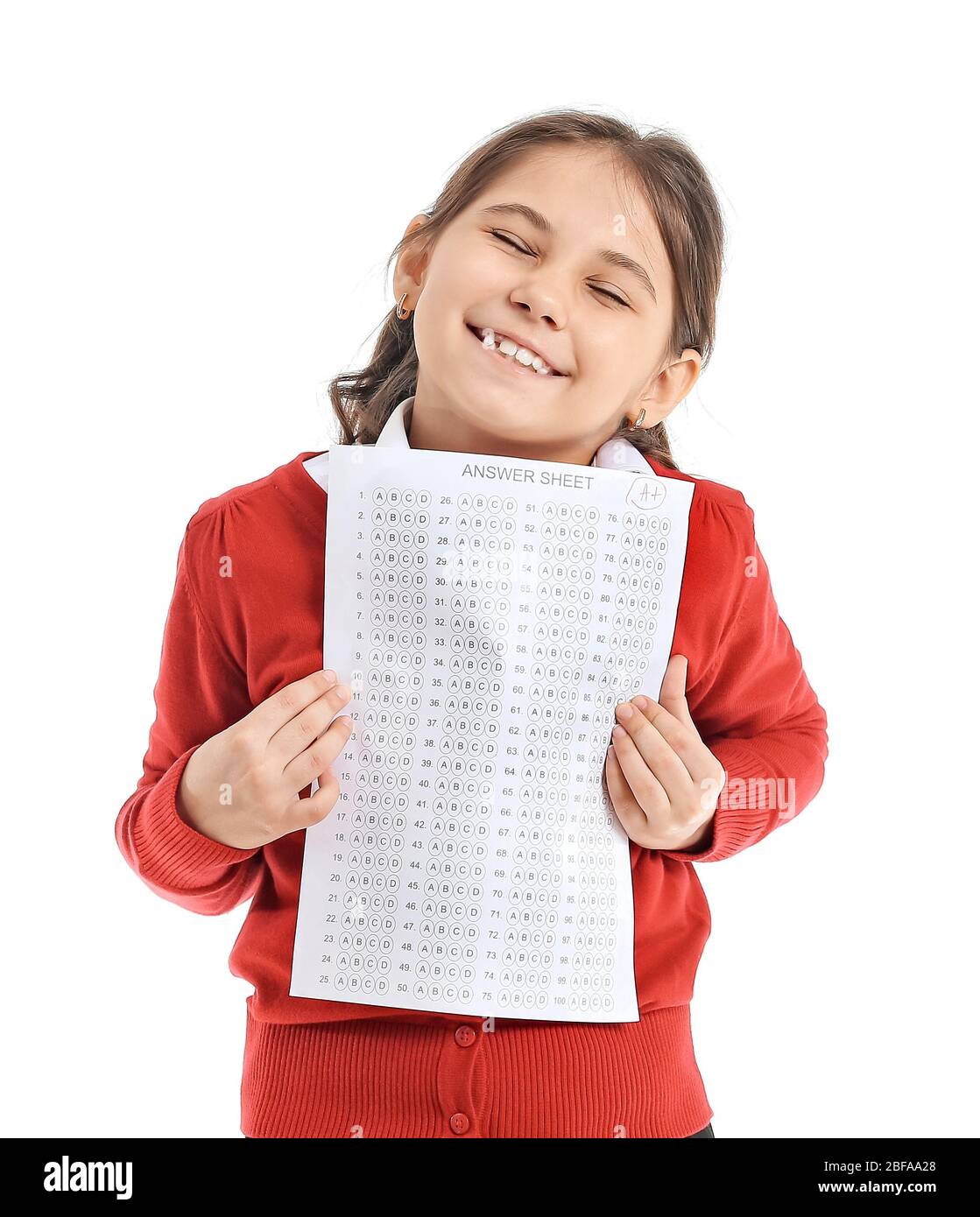Pupil with answer sheet for school test on white background Stock Photo ...