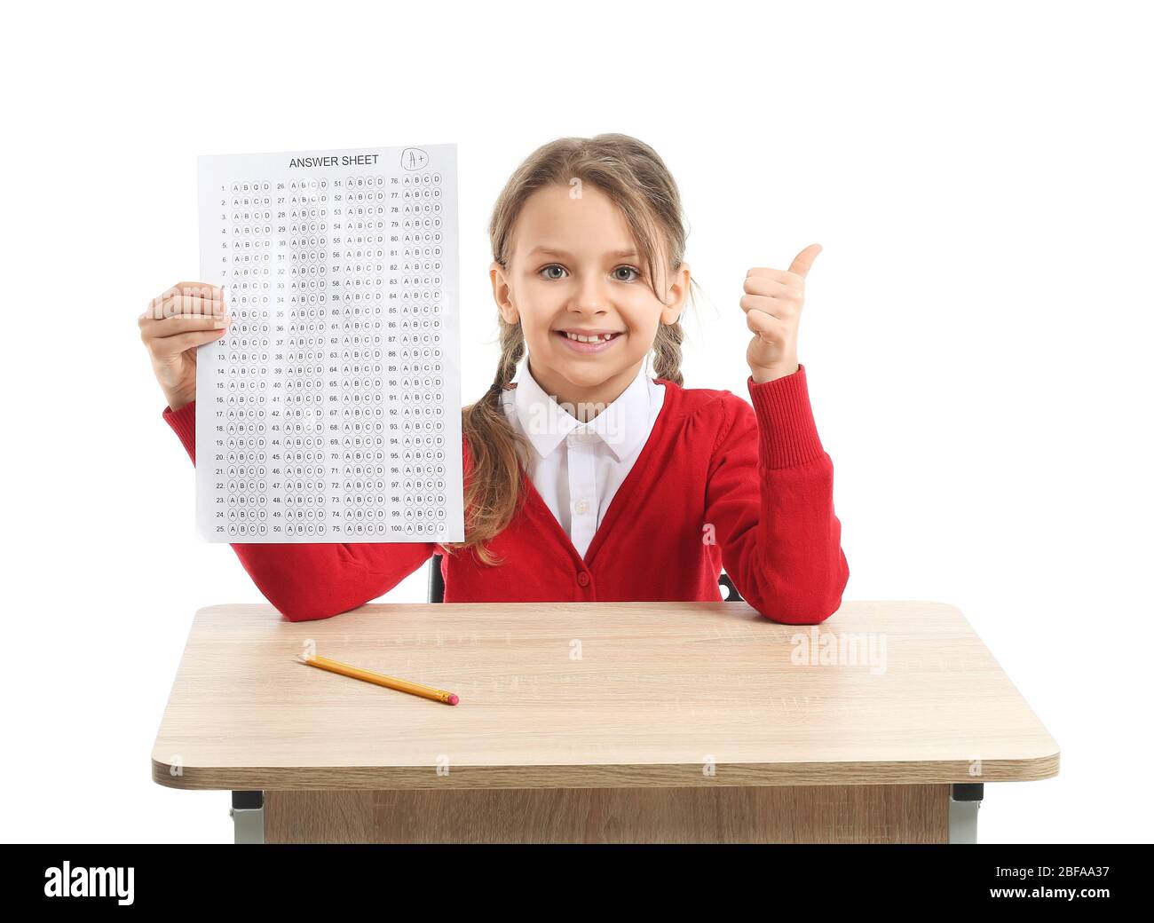 Pupil with answer sheet for school test on white background Stock Photo ...
