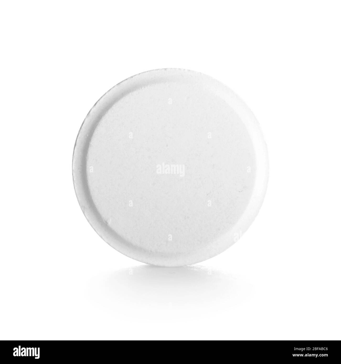 One pill on white background Stock Photo - Alamy