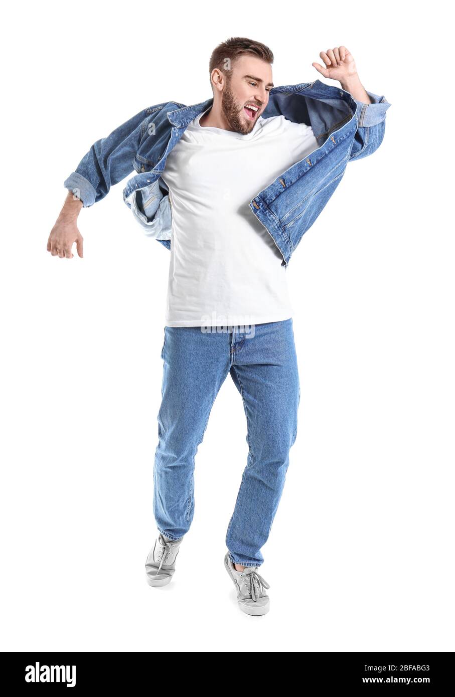 Handsome young man dancing against white background Stock Photo - Alamy