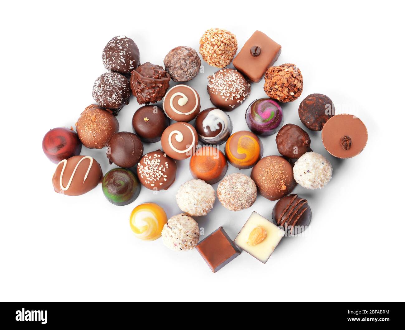 Assortment of delicious candies on white background Stock Photo - Alamy