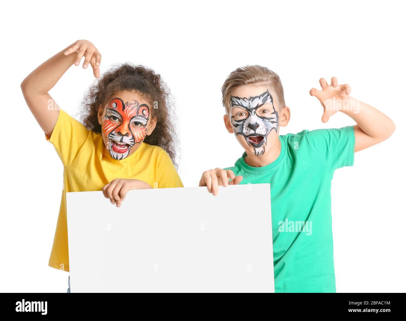 Funny children with face painting and blank poster on white background ...
